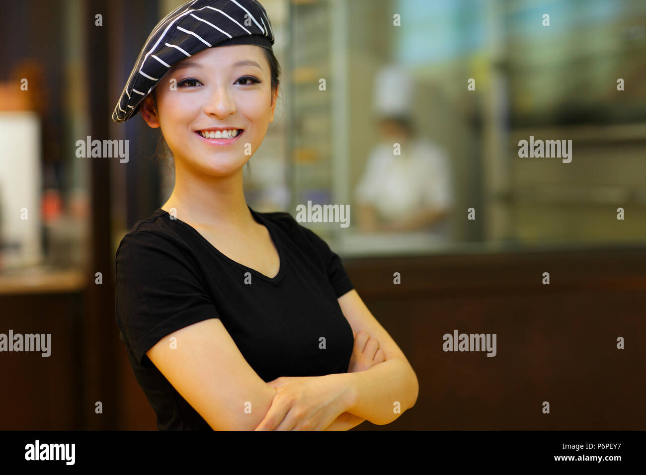 female baker in bakery working Stock Photo - Alamy