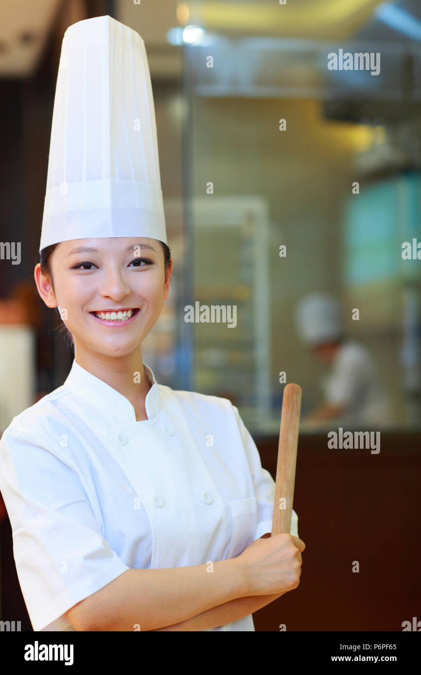 female baker in bakery working Stock Photo - Alamy