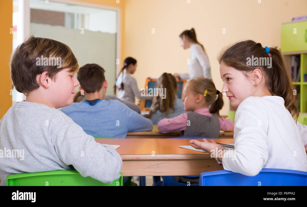 Portrait of children discussing something during lesson in school Stock ...
