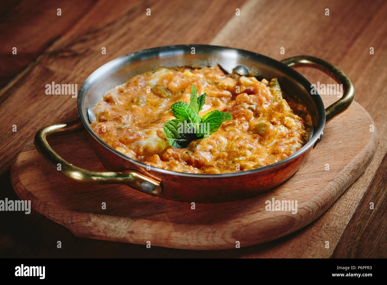 Traditional turkish food menemen made by eggs and tomatoes Stock Photo ...