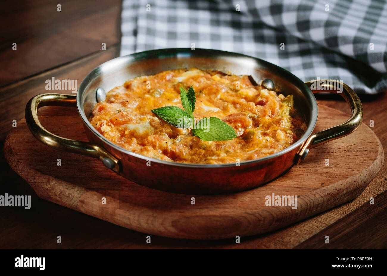 Traditional turkish food menemen made by eggs and tomatoes Stock Photo ...