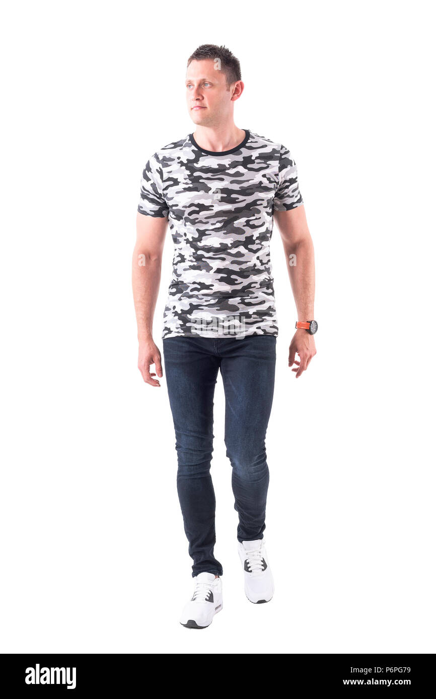 Cool confident handsome man in camouflage t-shirt walking towards ...