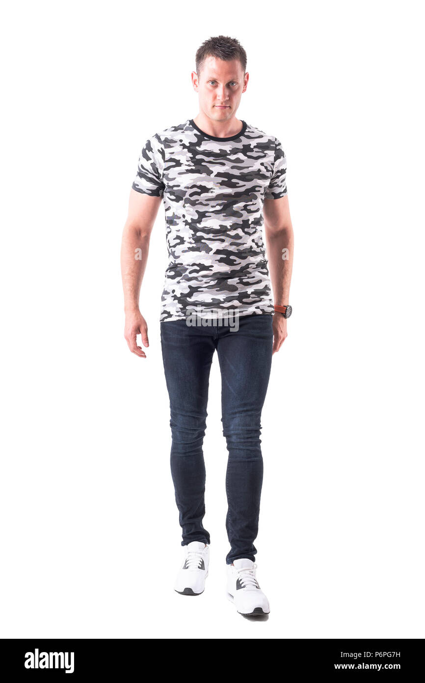 Front view of serious confident man in army shirt walking towards ...