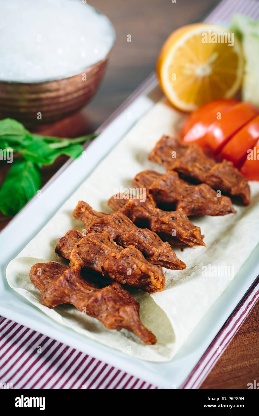 Cigkofte turkish meatball from bulgur with tomato, lemon, and lettuce ...