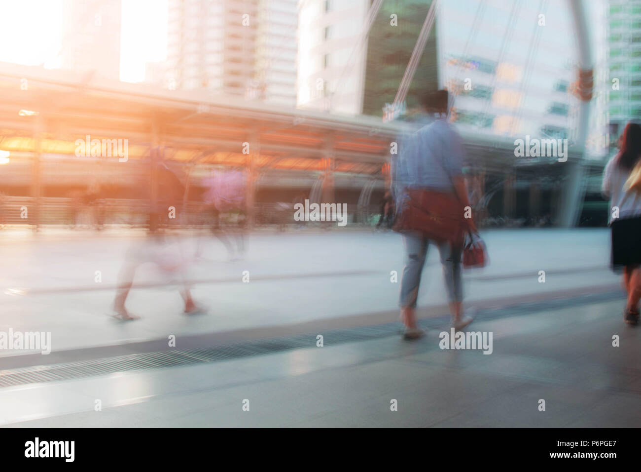 People are walking in landmark with blur image Stock Photo - Alamy