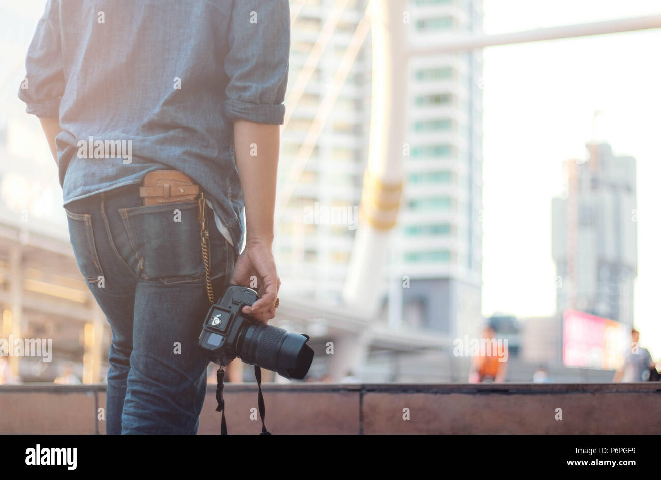 Photographers holding camera with Thailand tourist Stock Photo - Alamy