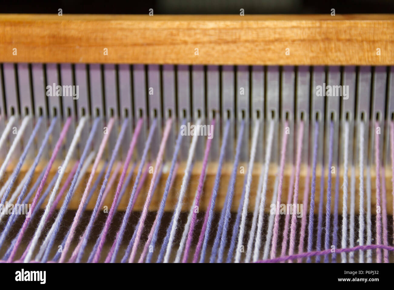 detail of fabric in comb loom with ultraviolet and lilac colors Stock ...