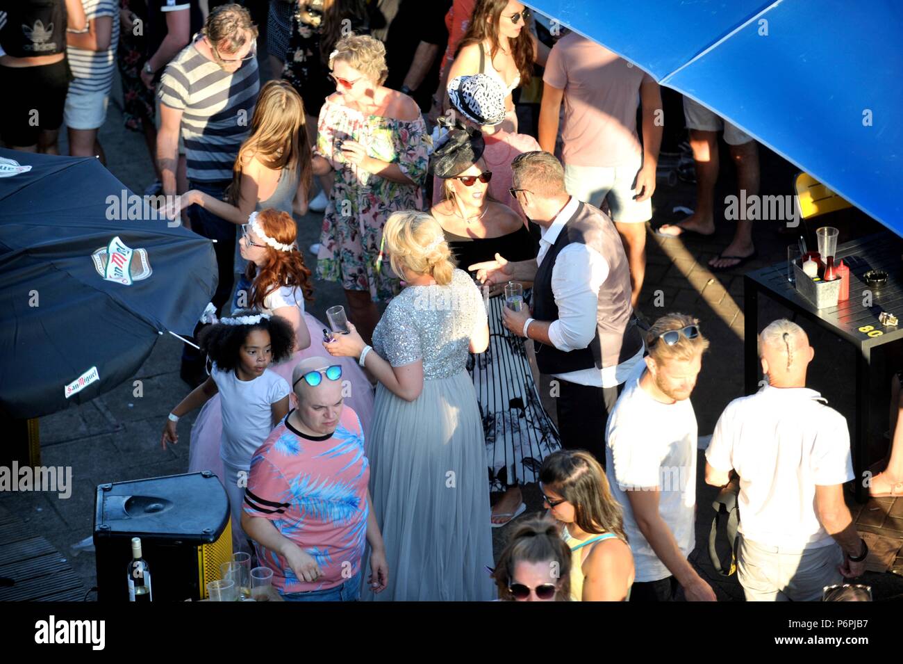 People enjoying the sunny weather on brighton beach in sussex hi-res ...