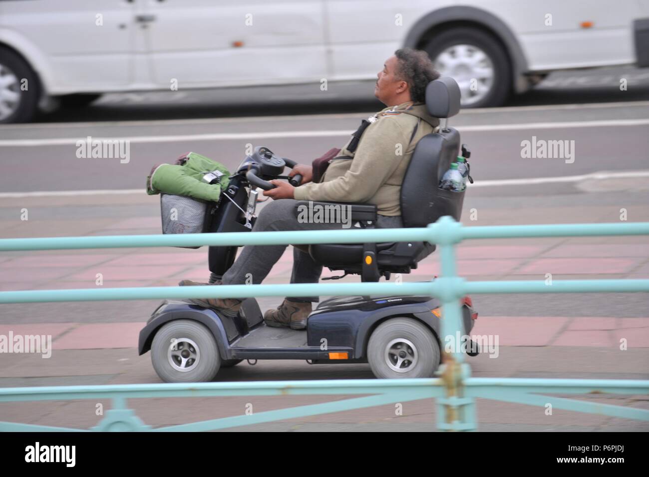 Man on disabled mobility scooter Stock Photo - Alamy