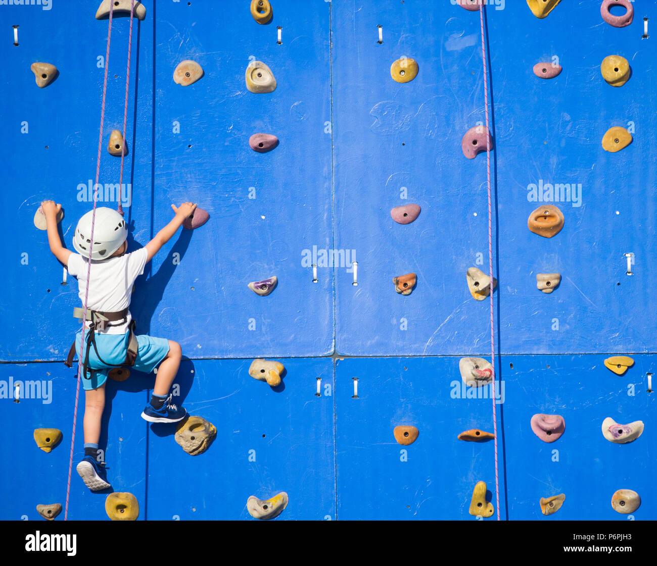 Wall climbing and children helmet hi-res stock photography and images ...