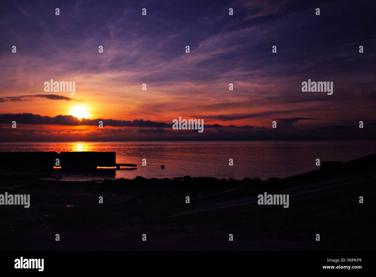 Beautiful Sun Rising at a Tropical Beach Paradise Stock Photo - Alamy