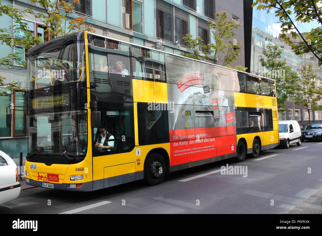BERLIN, GERMANY - AUGUST 27, 2014: People ride a Man city bus in Berlin ...