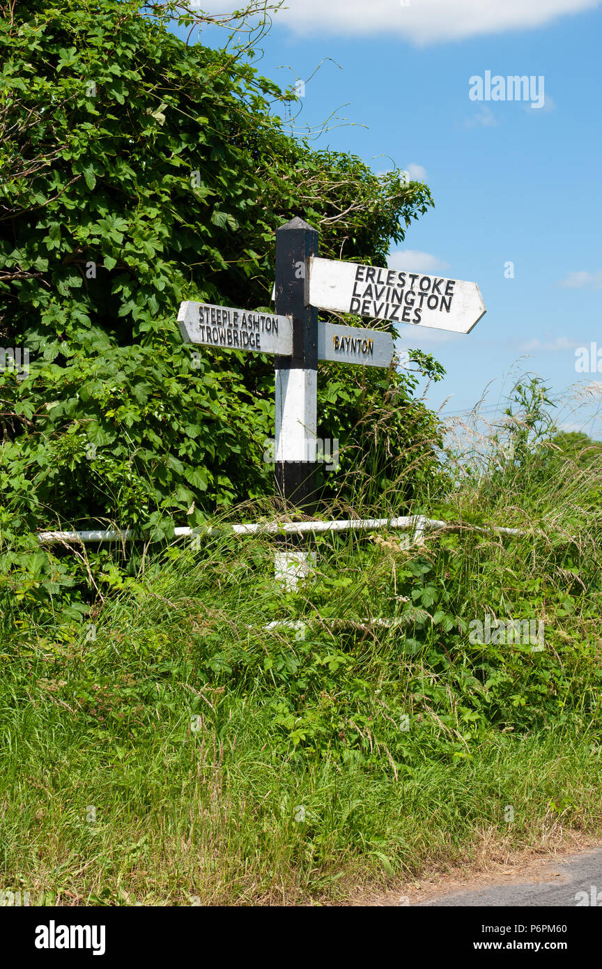 Traditional roadside, black and white signpost in Wiltshire, UK Stock ...