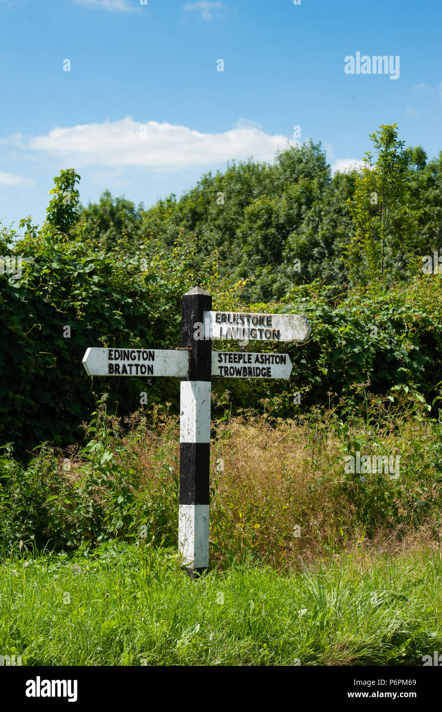 Traditional roadside, black and white signpost in Wiltshire, UK Stock ...