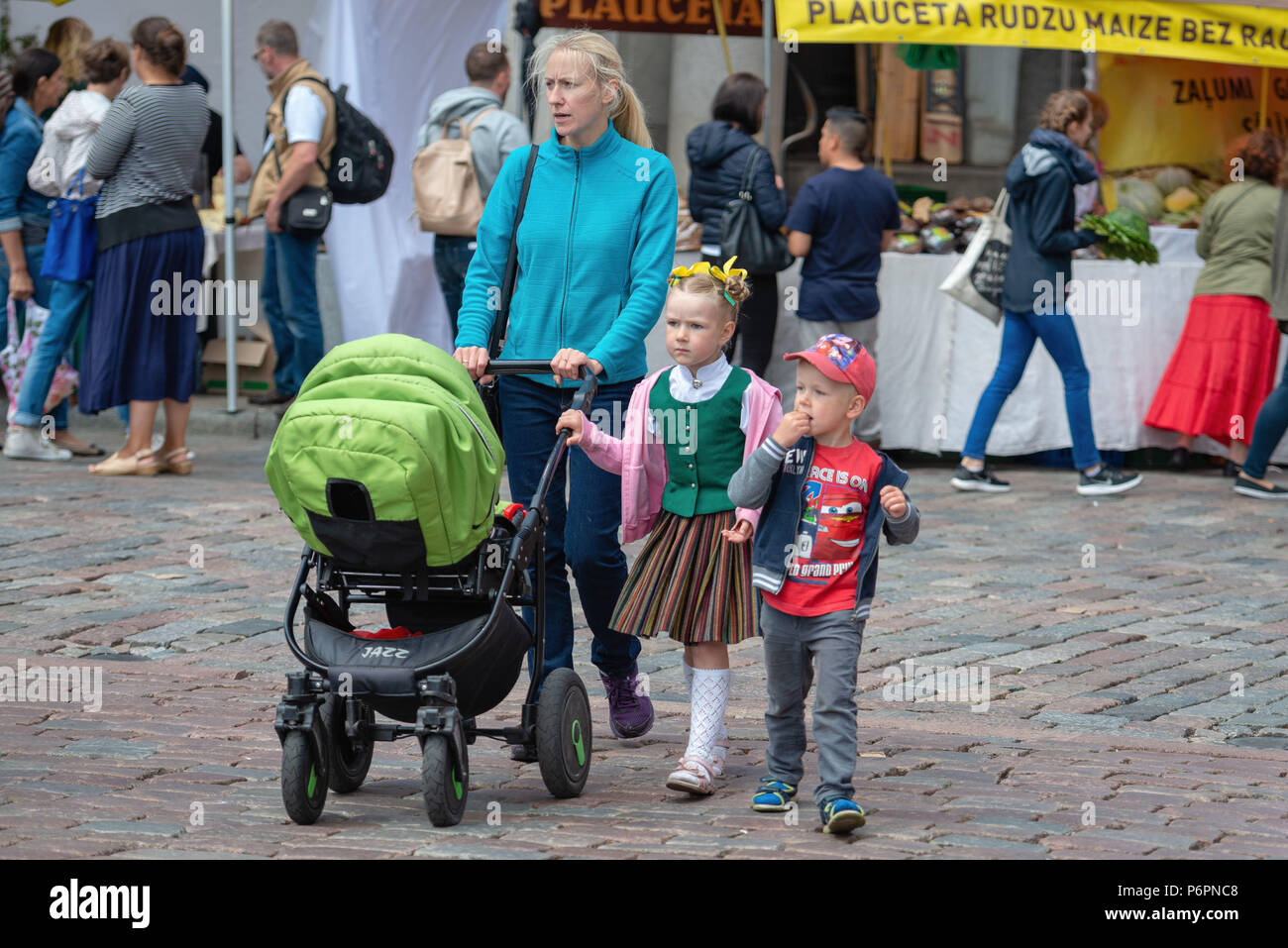 RIGA, LATVIA - JUNE 22, 2018: Summer solstice market. Family with ...
