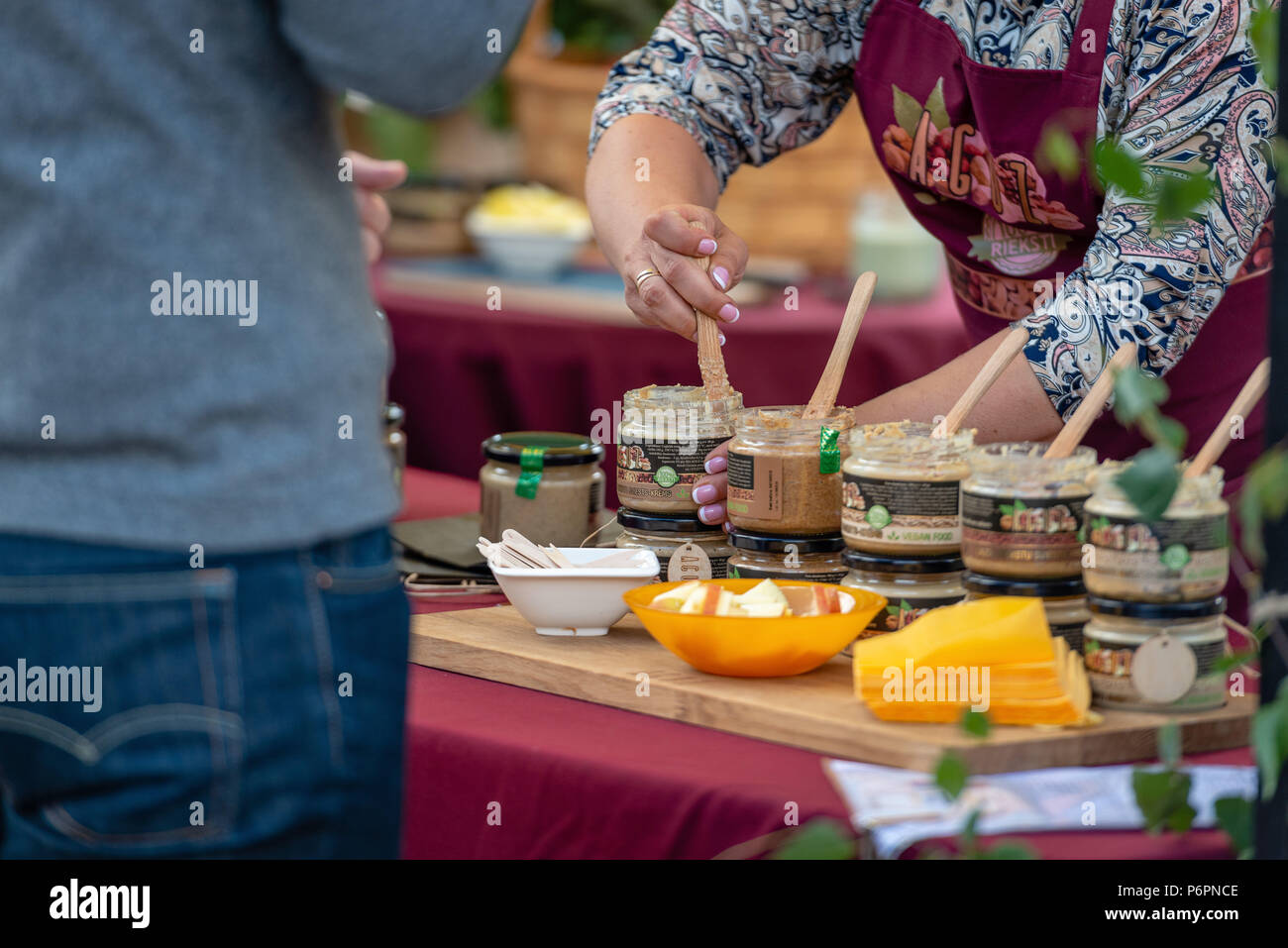 RIGA, LATVIA - JUNE 22, 2018: Summer solstice market. The seller's ...