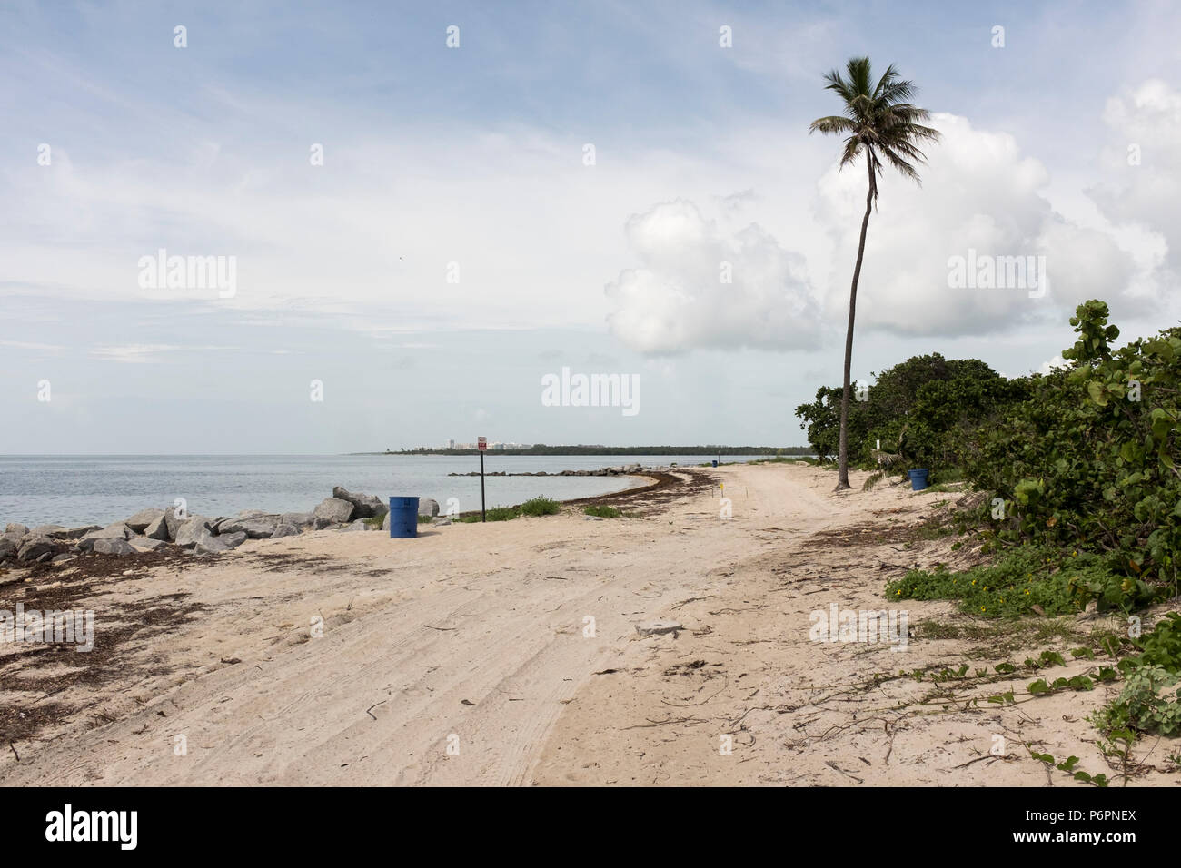 View along white sand beach on Virginia Key across water towards Key ...