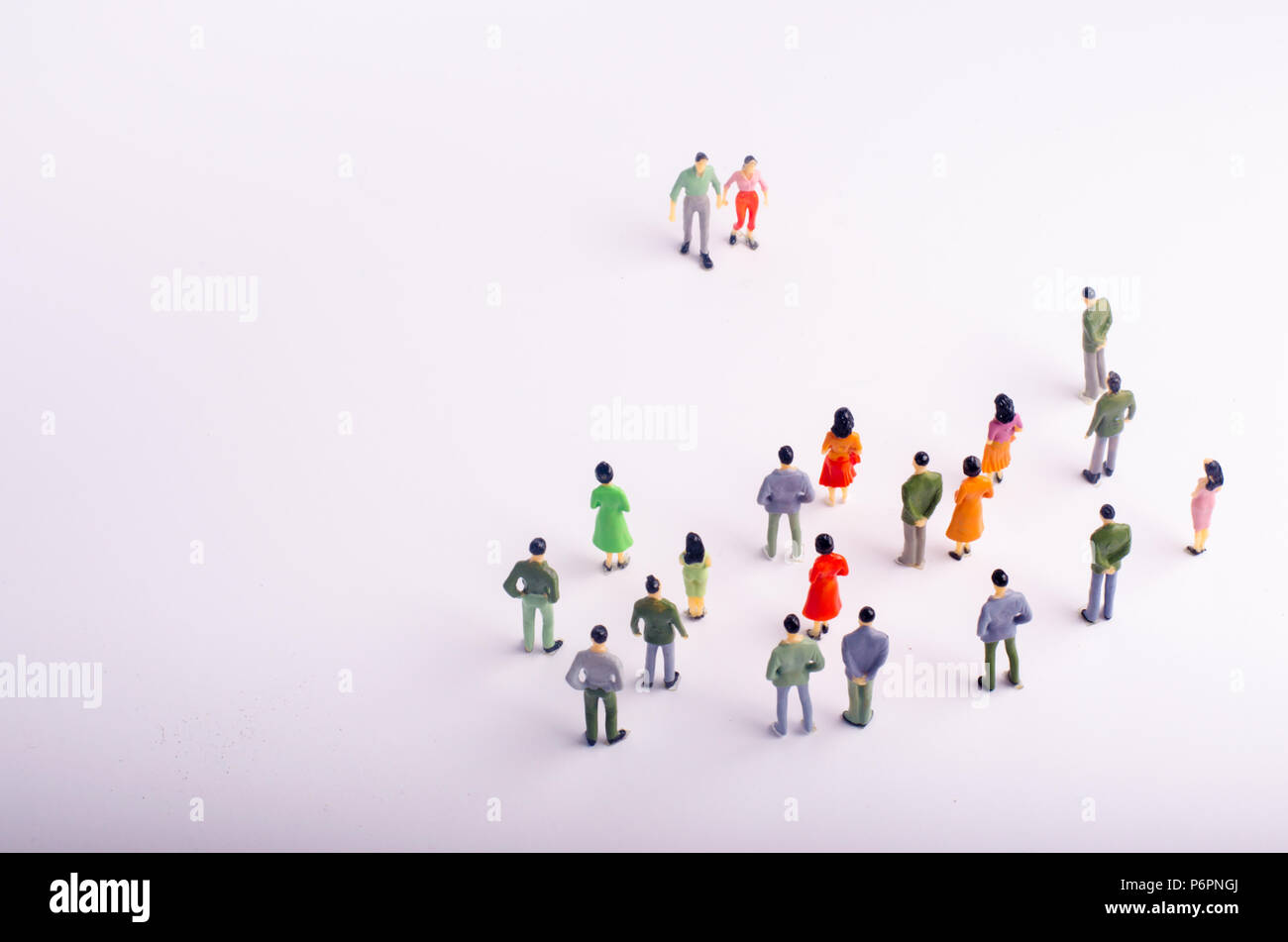 The crowd looks at the man and woman who comes towards her on a white ...