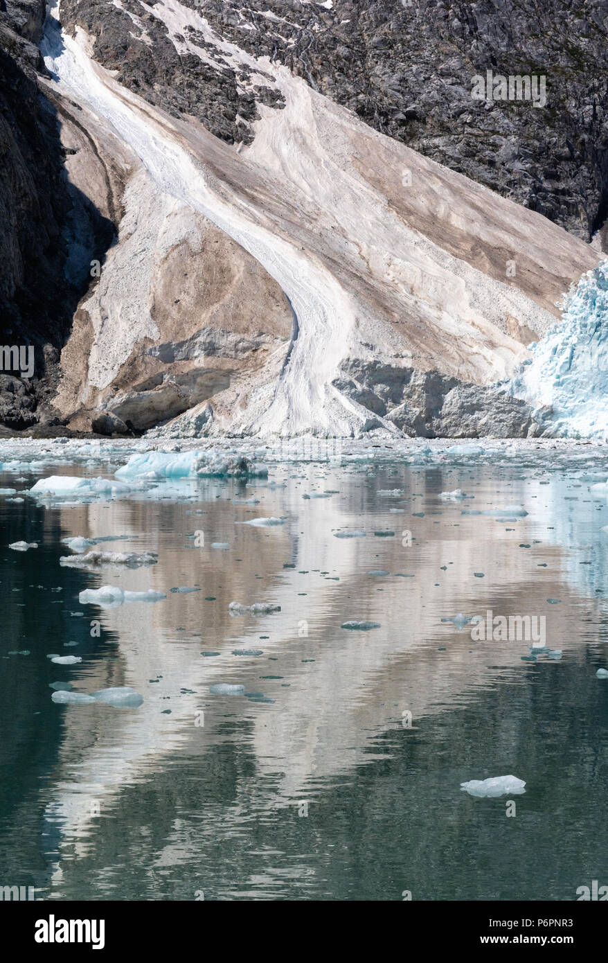 A snow chute channels avalanches straigh into sea and shatter bobbing ...