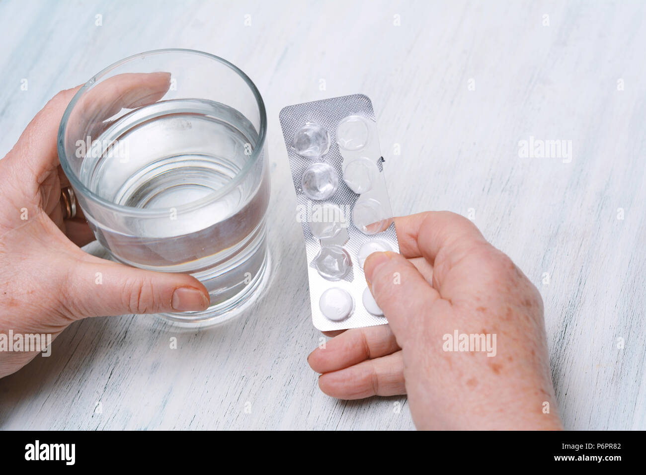 Old man holding tablet of pill. Medicine concept Stock Photo - Alamy
