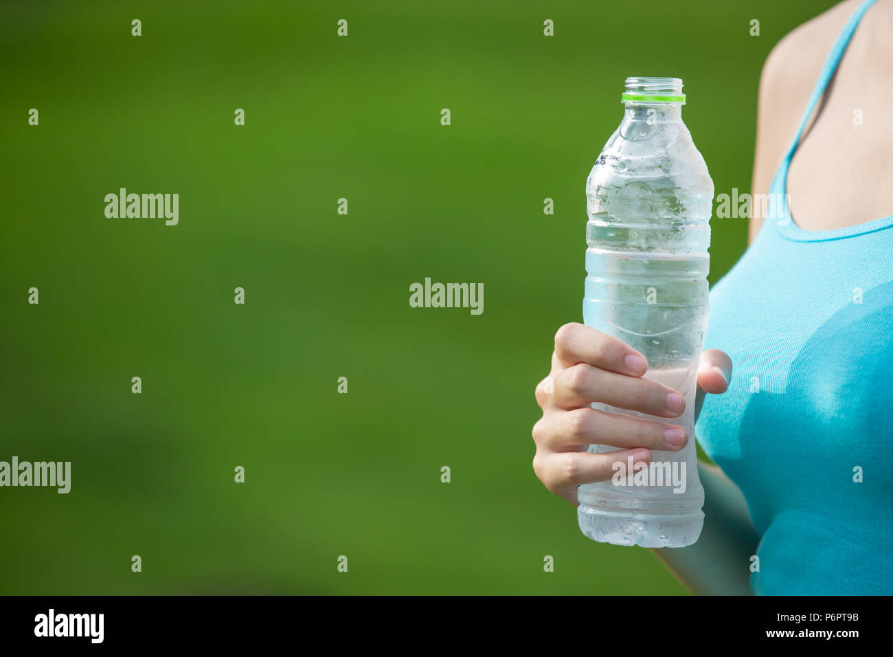 Girl drinking water exercise Stock Photo - Alamy