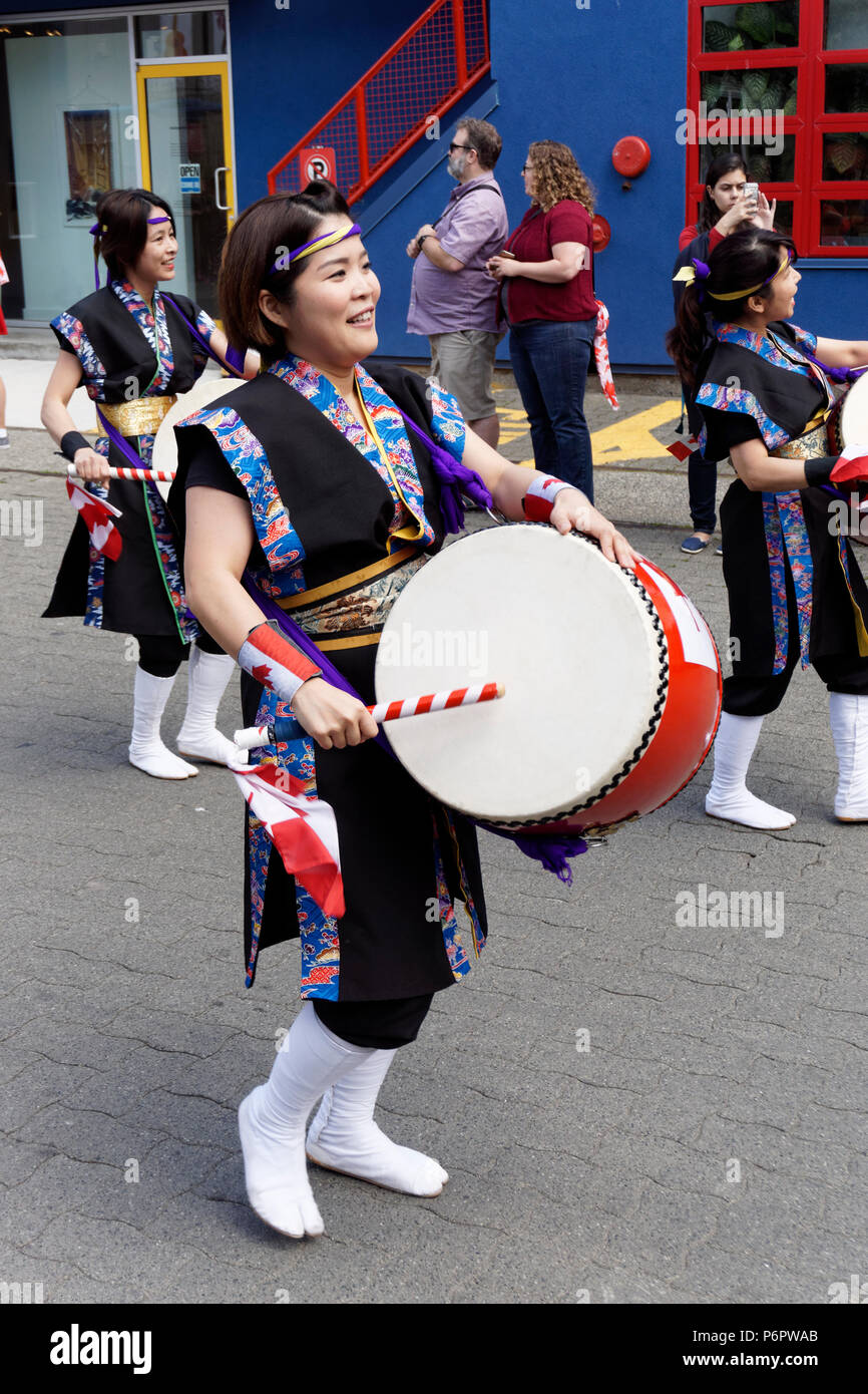Young Japanese Canadian women beat drums in the annual Canada Day ...
