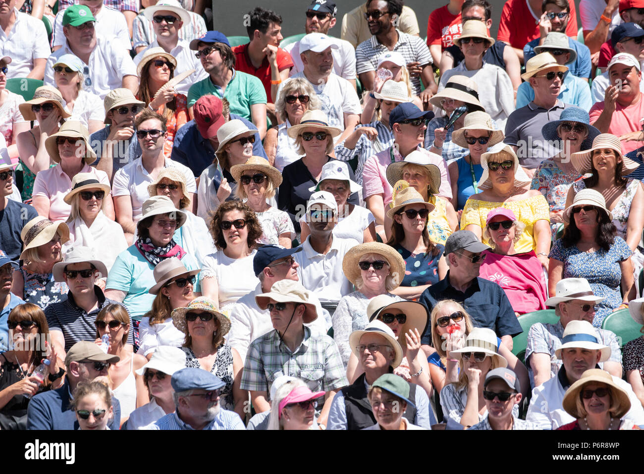 Wimbledon, London, UK. 2nd July, 2018. Spectators watch centre court ...