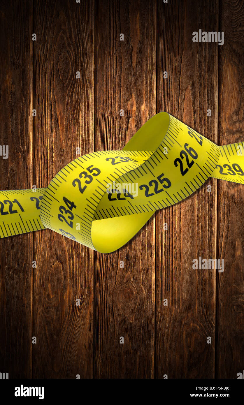 tape measure with wooden background Stock Photo - Alamy