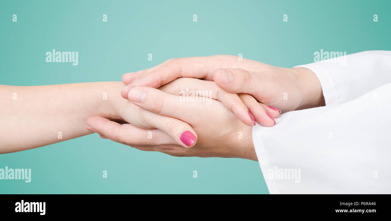 Doctor holding patient hand close up. Doctor and patient, health care ...