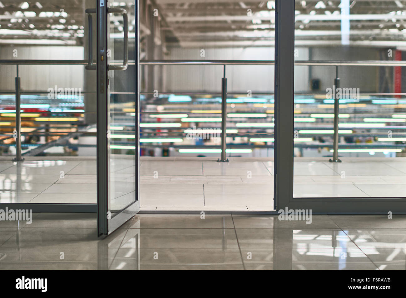 Open door in the modern office or shopping center with bokeh background ...