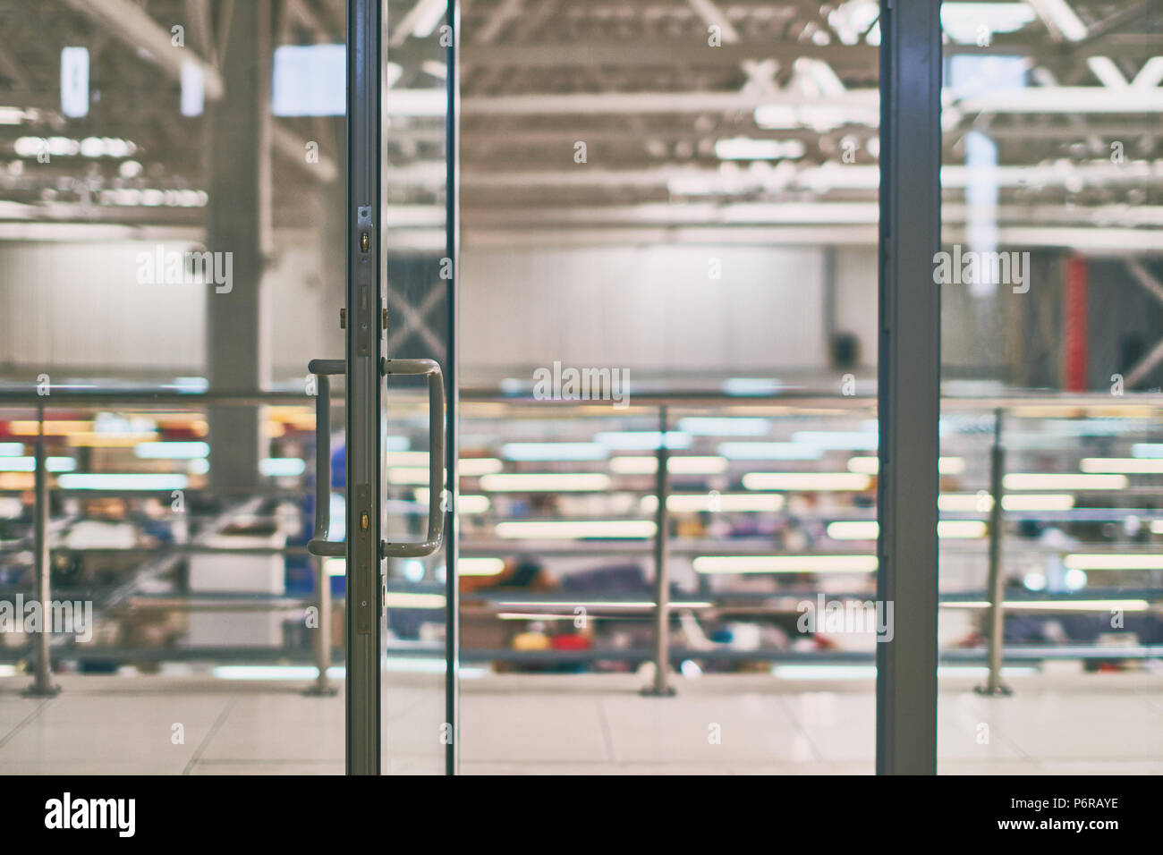 Open door in the modern office or shopping center with bokeh background ...