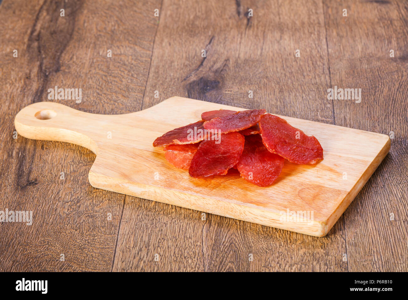 Dry pork meat heap over wooden Stock Photo - Alamy