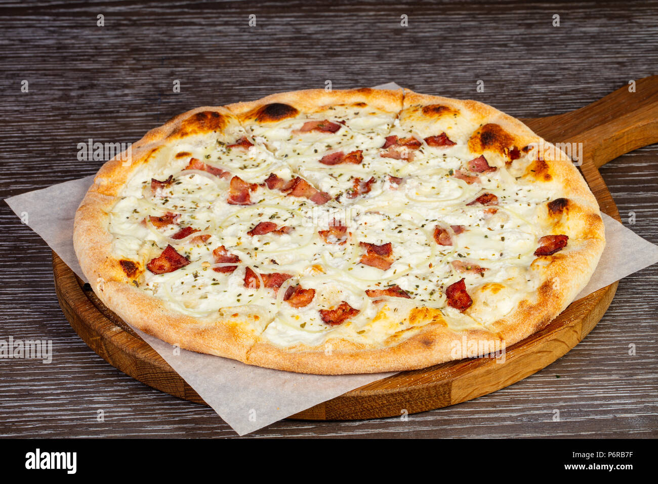 Delicious "Calzone" clossed pizza with bacon Stock Photo - Alamy
