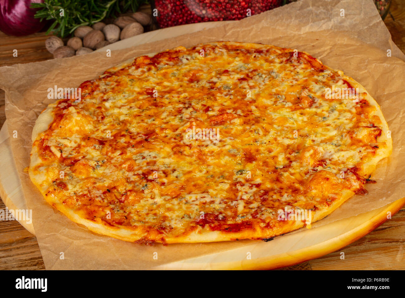 Delicious and big "4 cheese" pizza Stock Photo - Alamy
