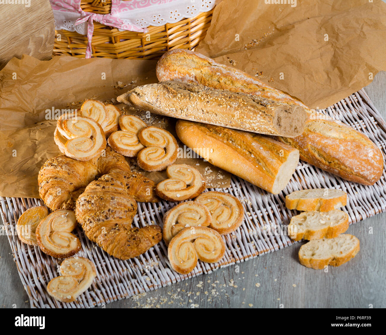 Image of various kinds of bread and bakery products on table Stock ...