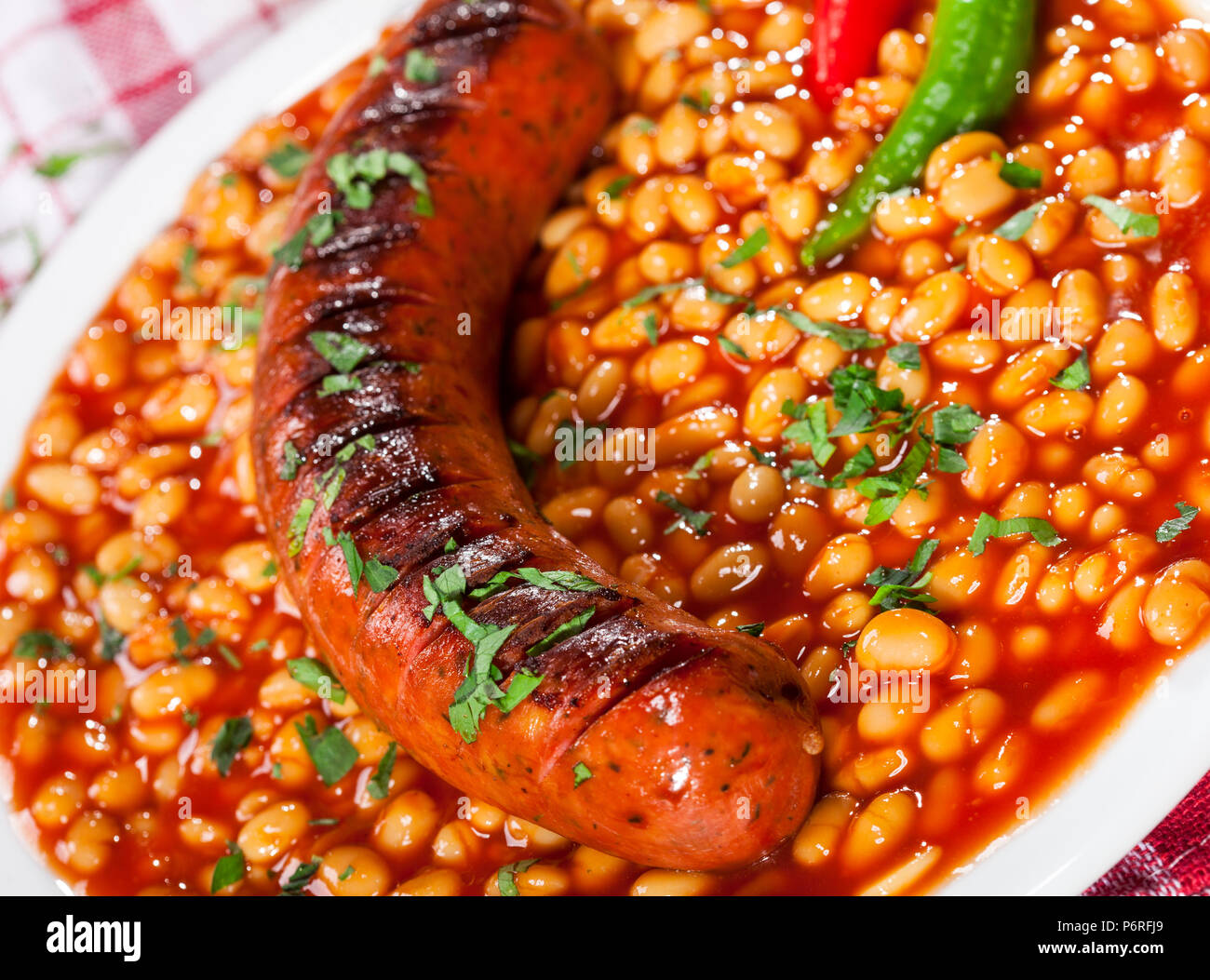 Beans with grilled sausage, traditional european homemade meal Stock ...