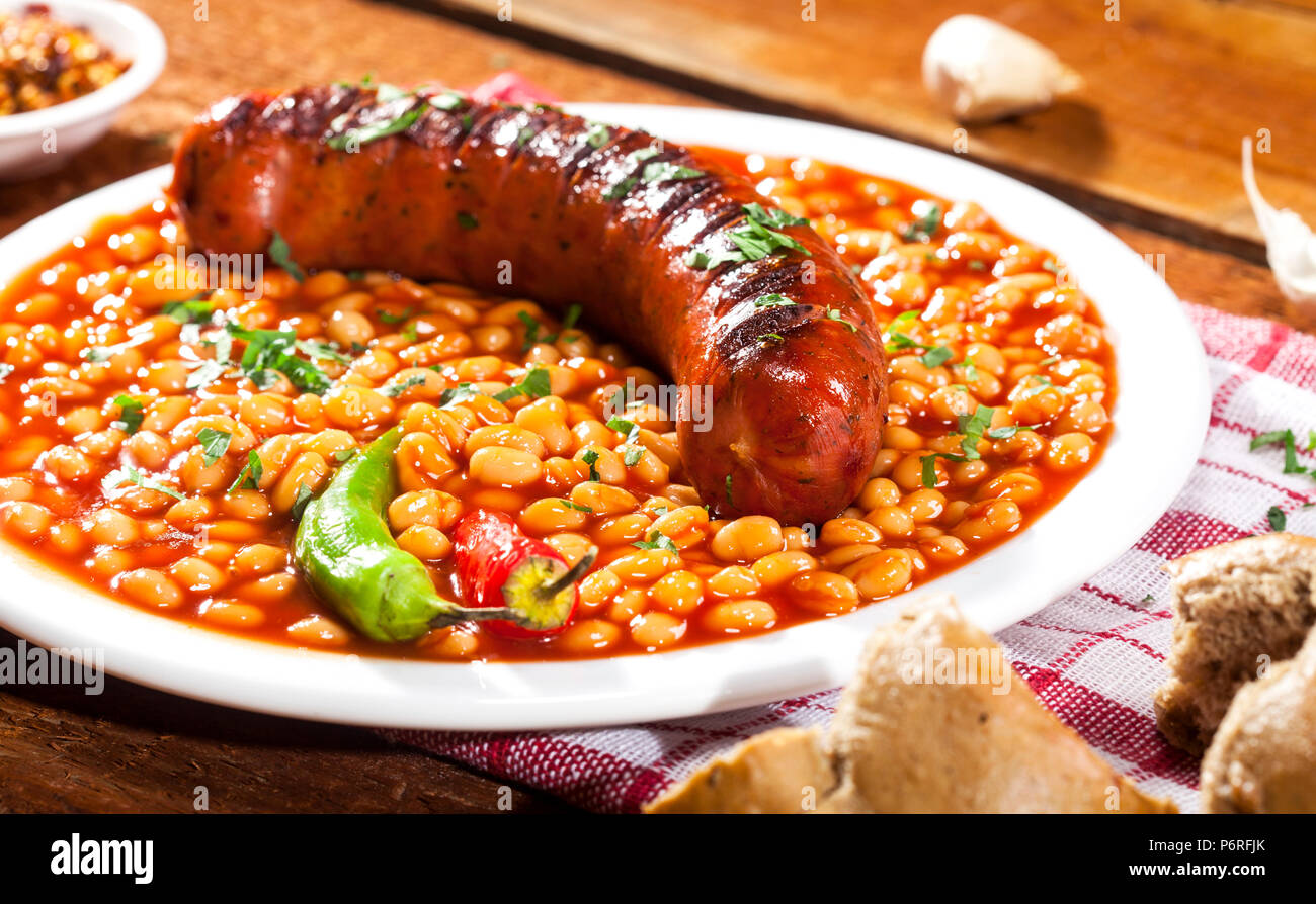 Beans with grilled sausage, traditional european homemade meal Stock ...