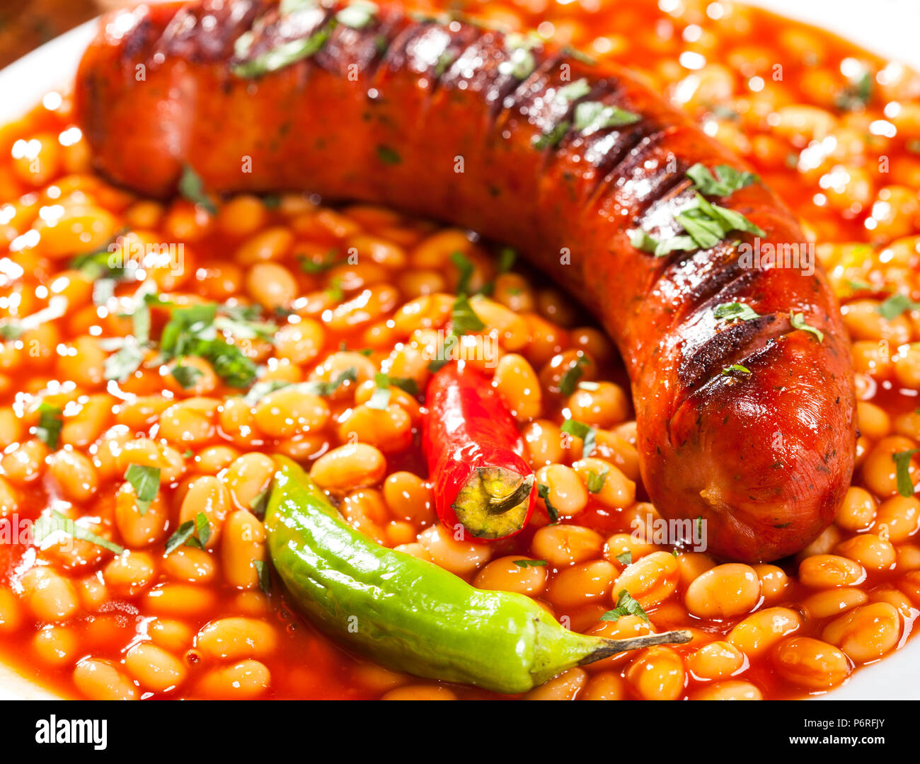 Beans with grilled sausage, traditional european homemade meal Stock ...
