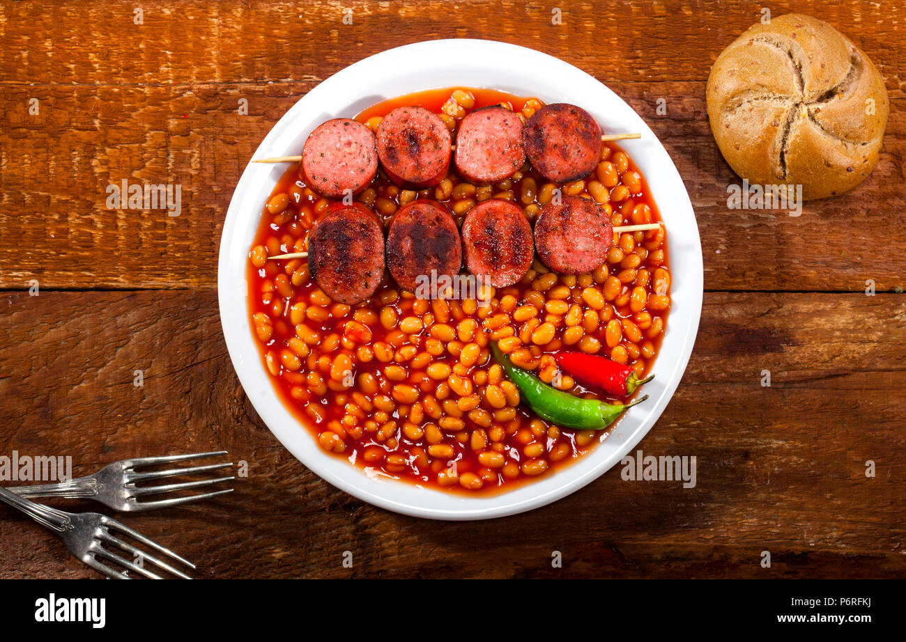 Beans with grilled sausage, traditional european homemade meal Stock ...