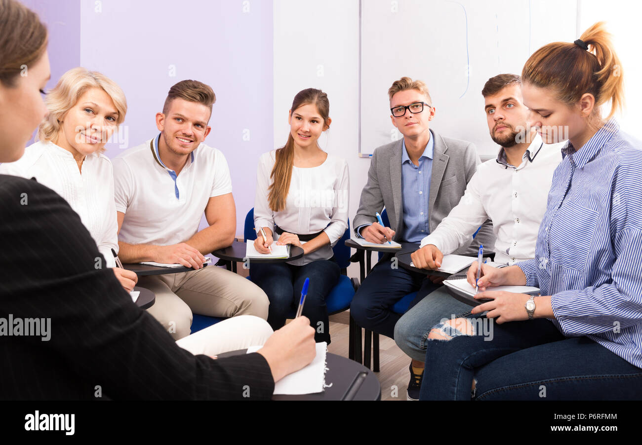 Group of cheerful students at extension courses together Stock Photo ...