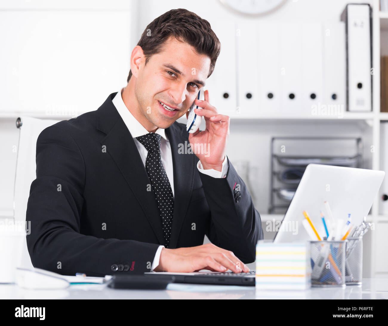 Businessman having phone call conversation at workplace in office Stock ...