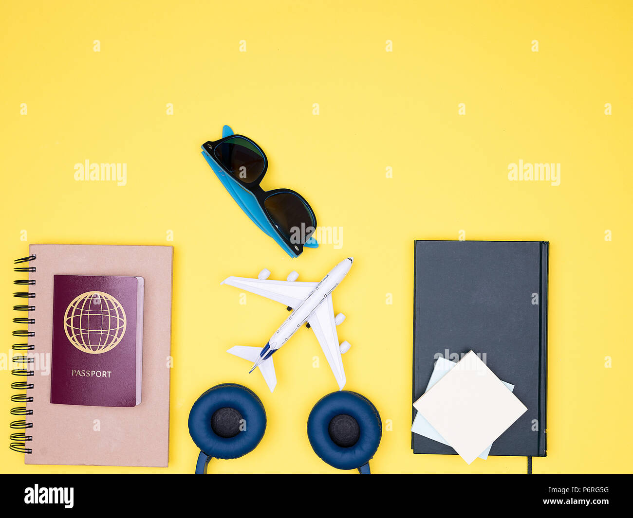 flat lay of traveler kit on yellow background Stock Photo - Alamy