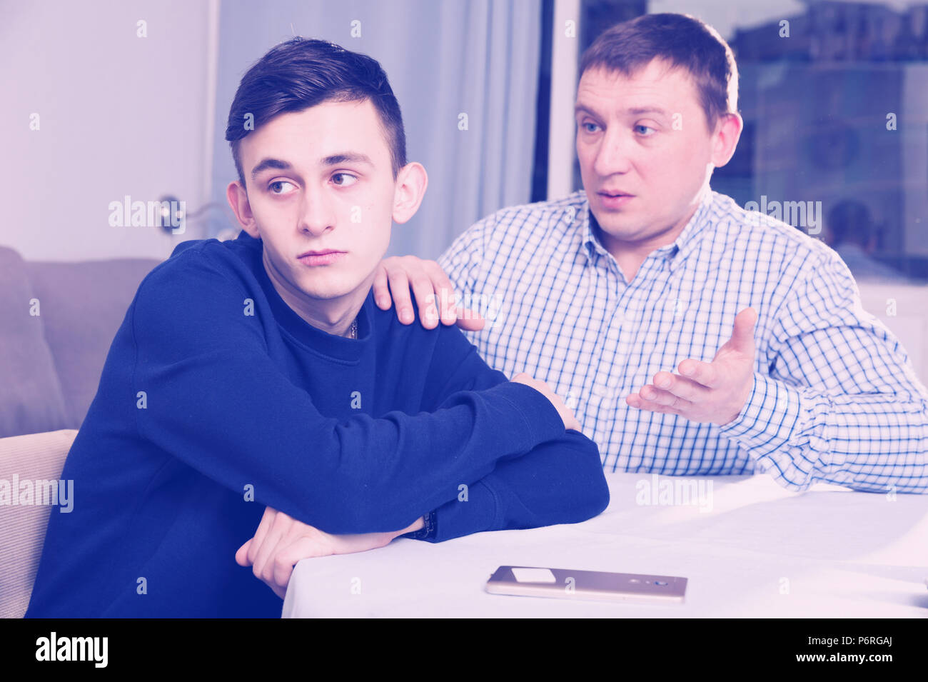 Teen boy talk father indoor hi-res stock photography and images - Alamy