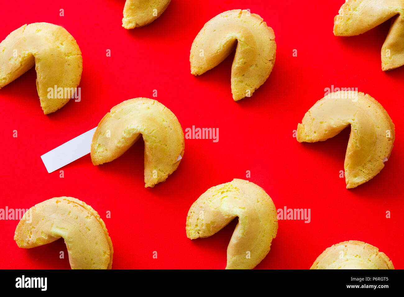 Fortune cookies pattern on red background Stock Photo - Alamy