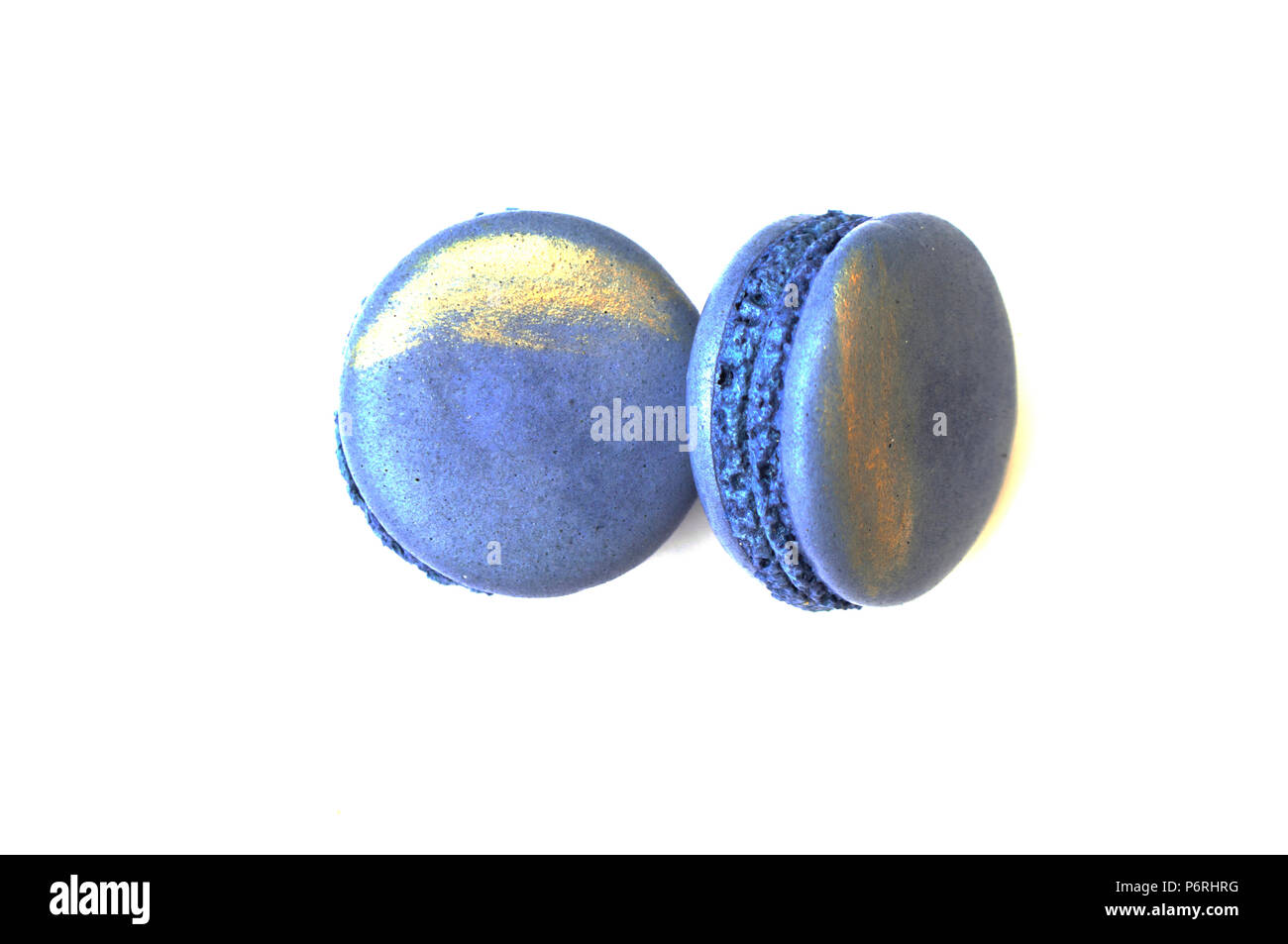 Two violet color macaroons with golden stroke isolated on white ...