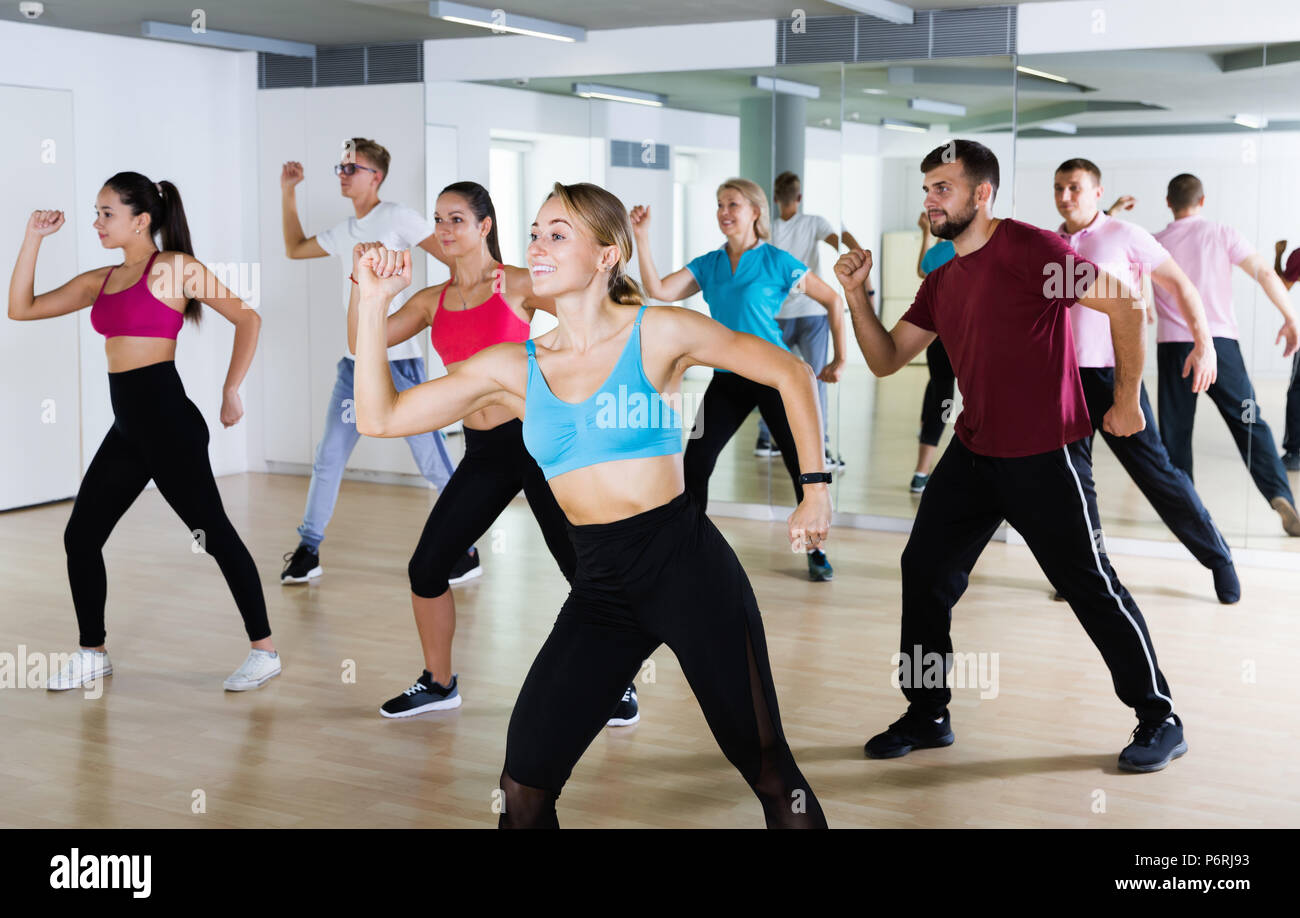 Happy women and men dancing together in dance school Stock Photo - Alamy