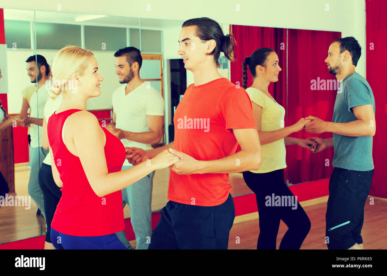 Group of american people dancing salsa in studio Stock Photo - Alamy
