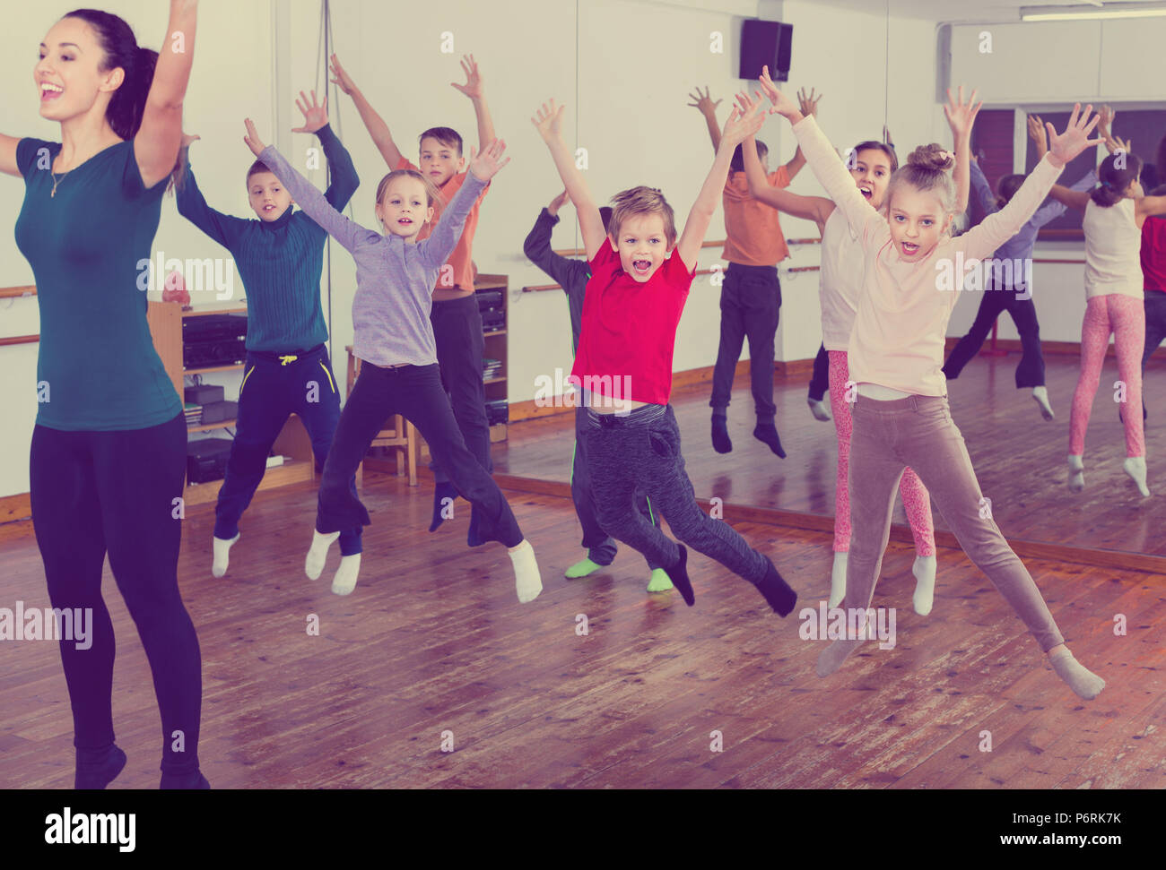 Happy friendly smiling children dancing contemp in studio smiling and ...