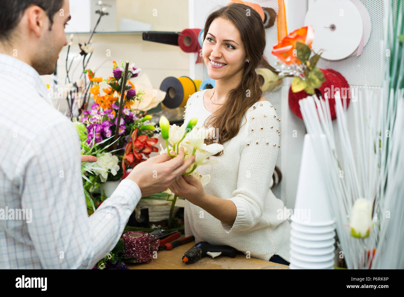 Female florist offering flowers hi-res stock photography and images - Alamy