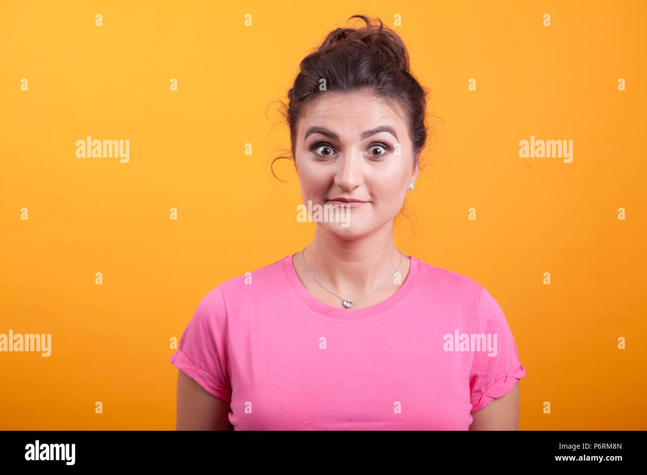 Beautiful young woman being amazed Stock Photo - Alamy